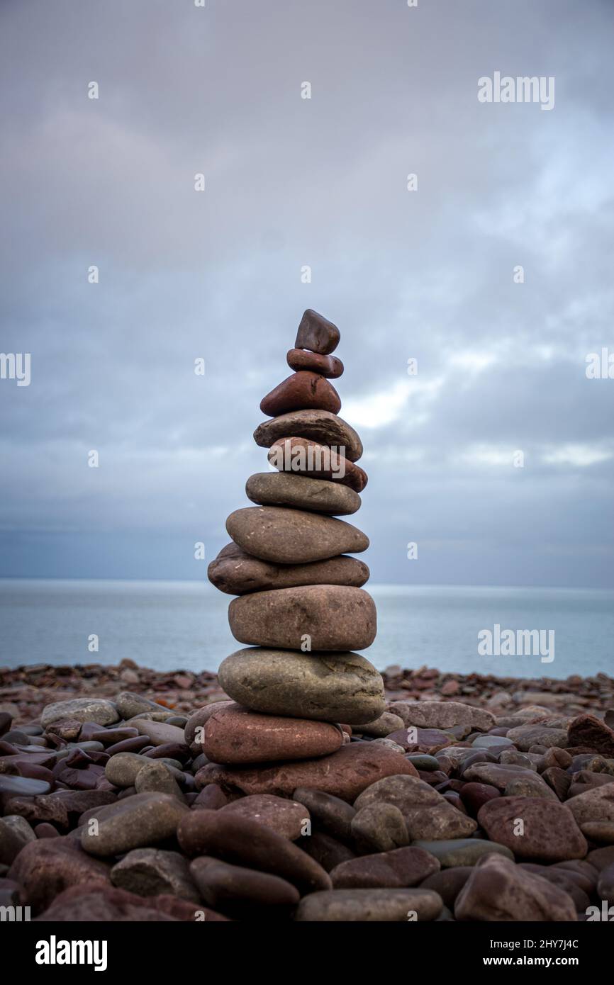 Closeup of a balanced stone tower on a beach Stock Photo - Alamy