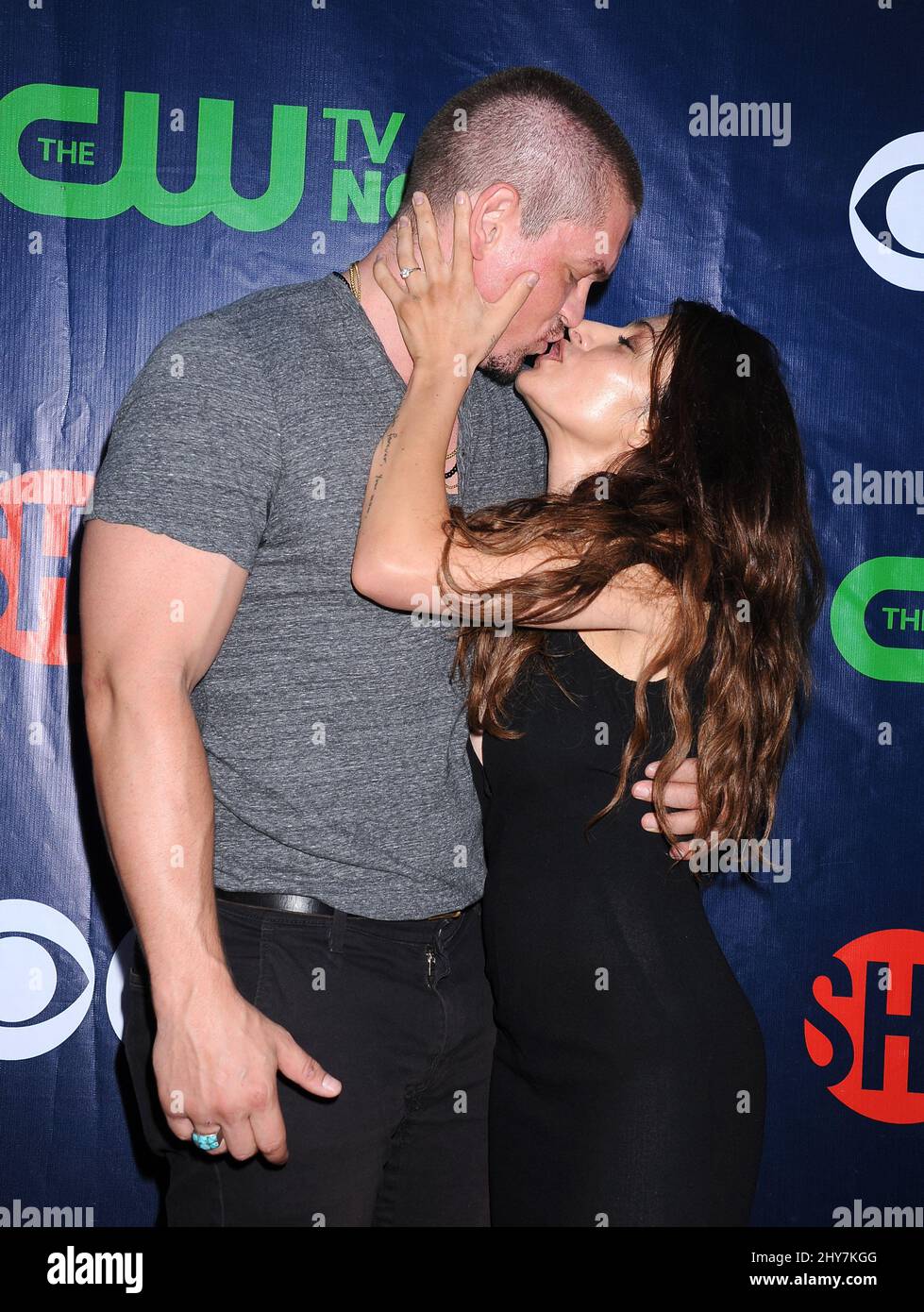 Steve Howey and Sarah Shahi attending the CBS, The CW and Showtime ...