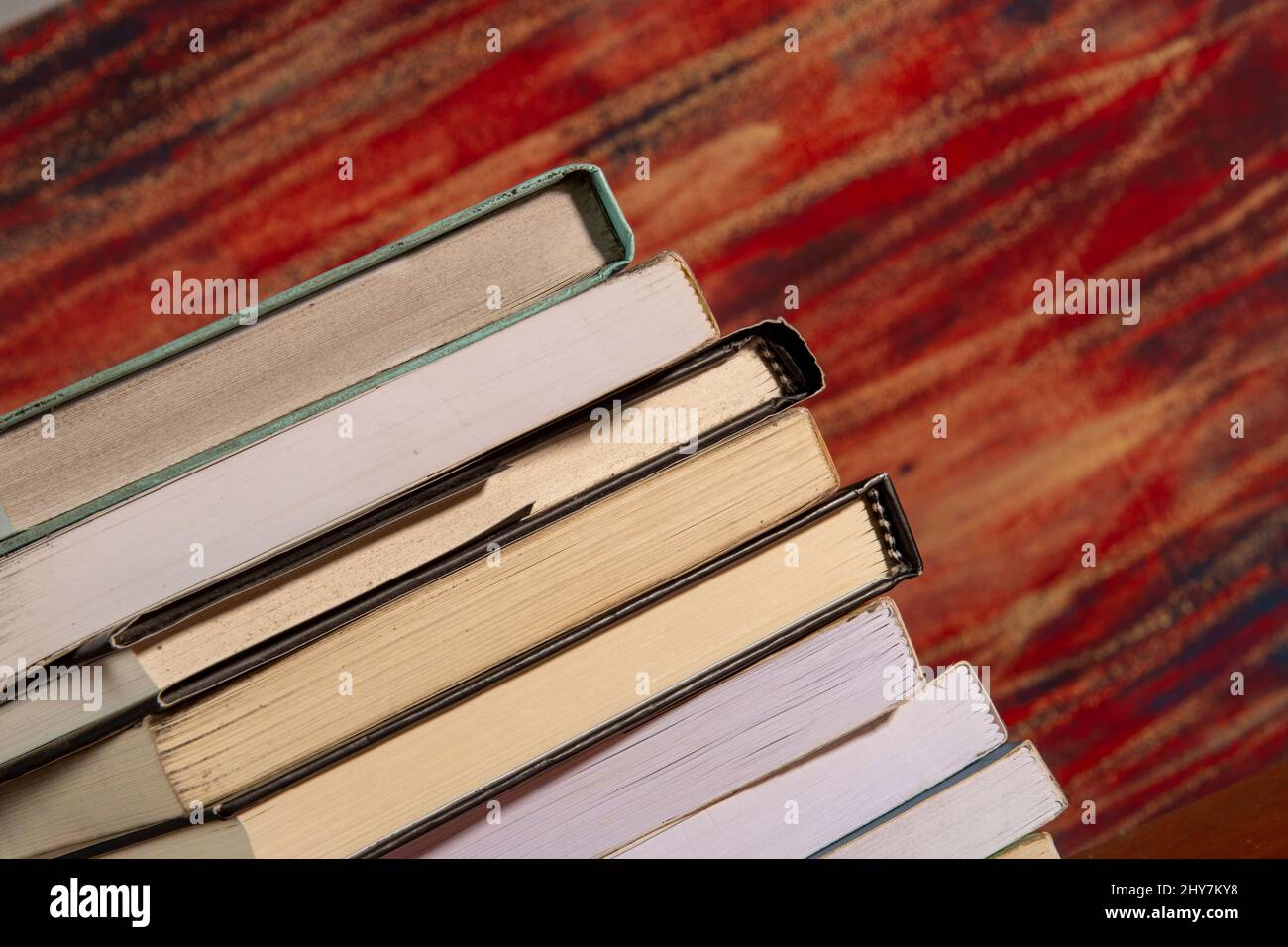Close-up of background stack of old used books. Pile of vintage old ...