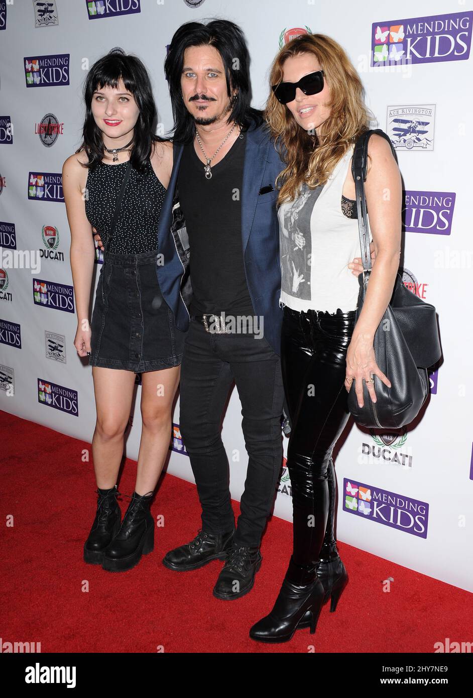 Gilby Clarke, Frankie Clarke, Daniella Clarke arriving for the Mending ...
