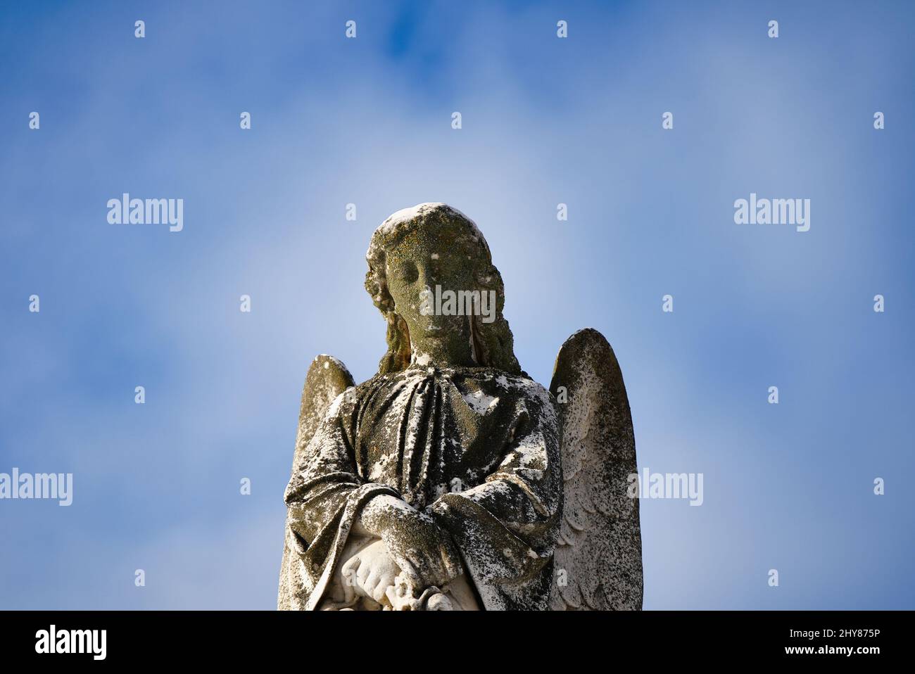 Old angel statue in the background of the sky Stock Photo - Alamy