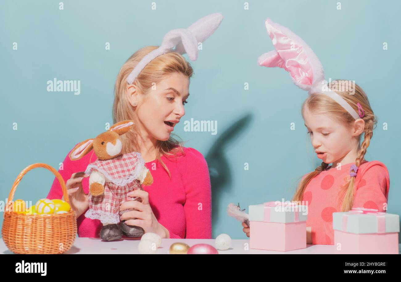 Happy easter. Mother and daughter child begin to hunt for Easter eggs ...