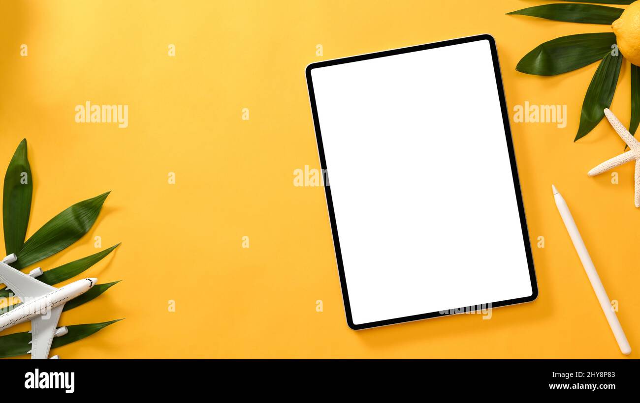 Modern yellow workspace background with digital tablet white screen ...