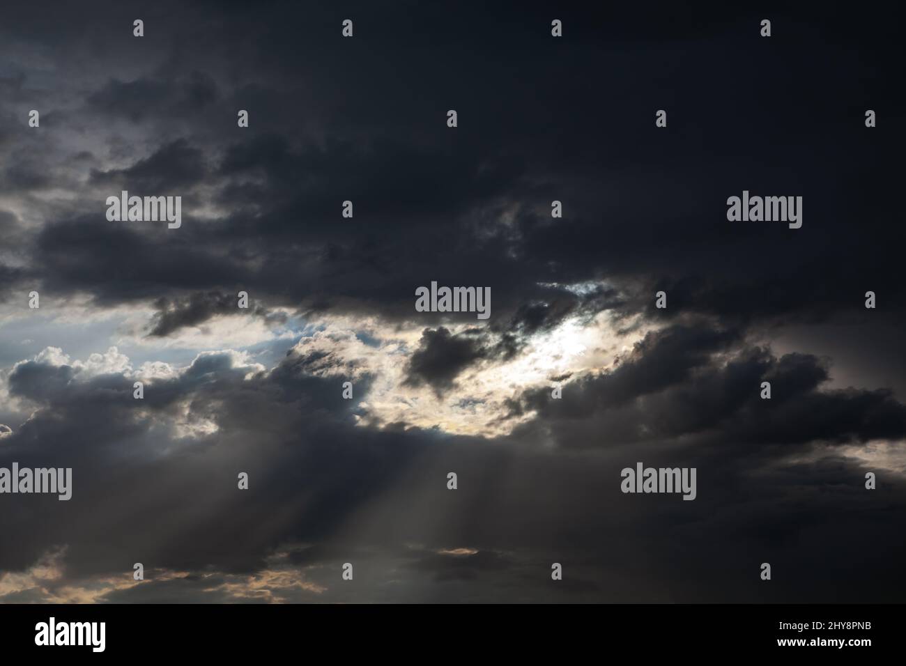 Dark clouds with rays . Heaven before heavy rain Stock Photo - Alamy