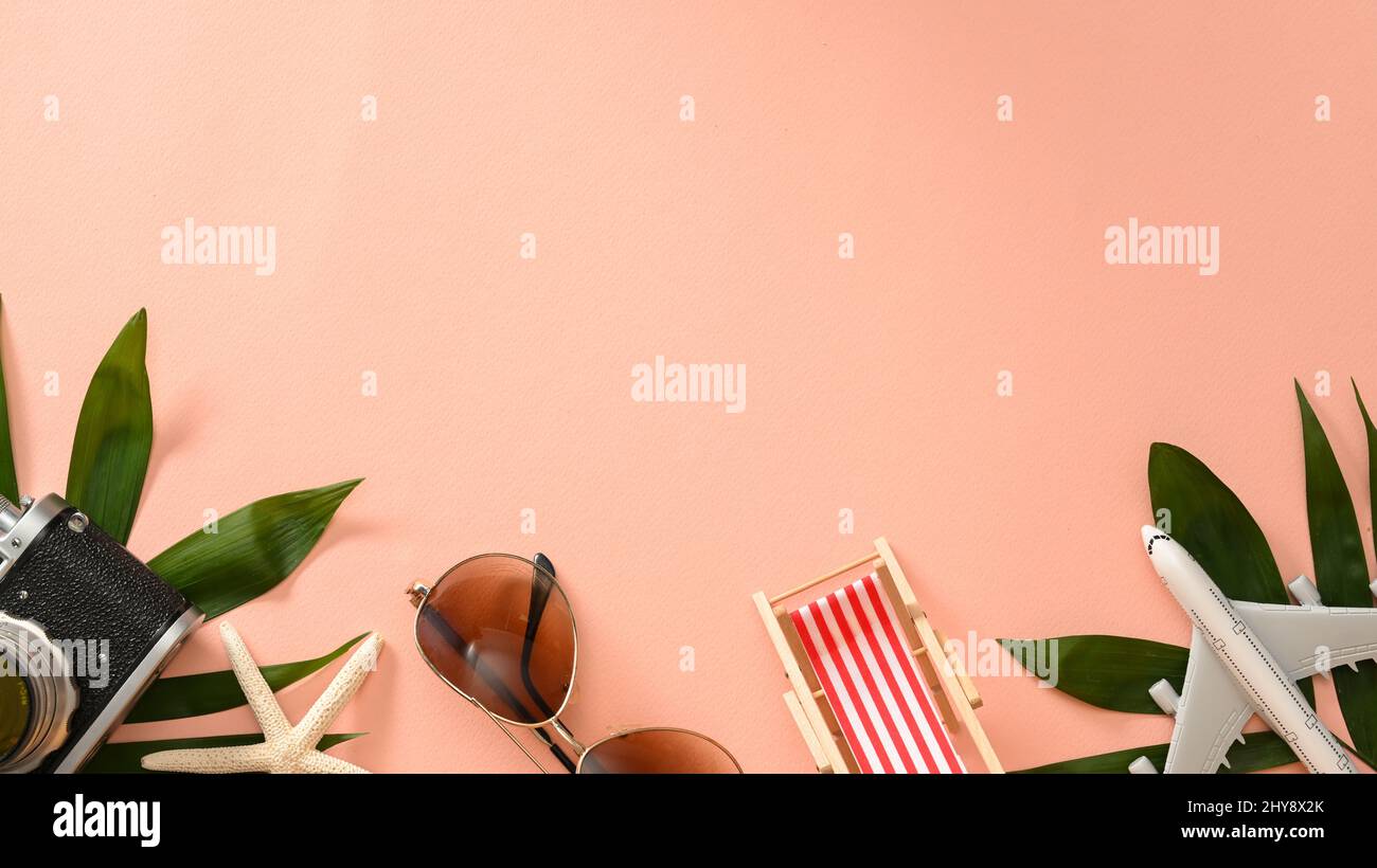 Summer beach travel holiday background in pink with accessories and ...