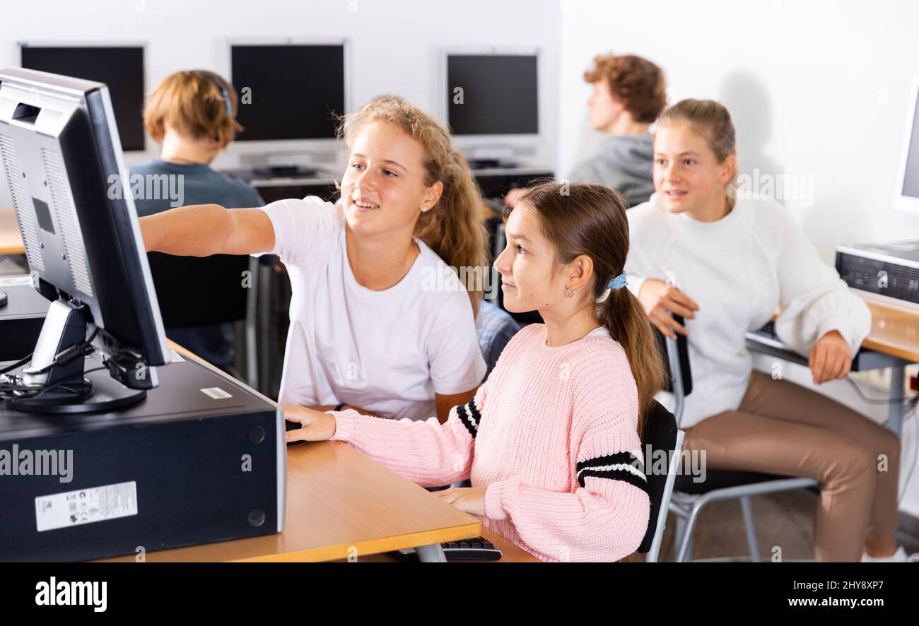 Portrait of two schoolgirls at the computer Stock Photo - Alamy