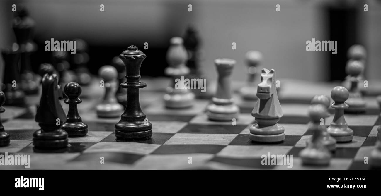 Close-up grayscale shot of a chess board with wooden figures Stock ...