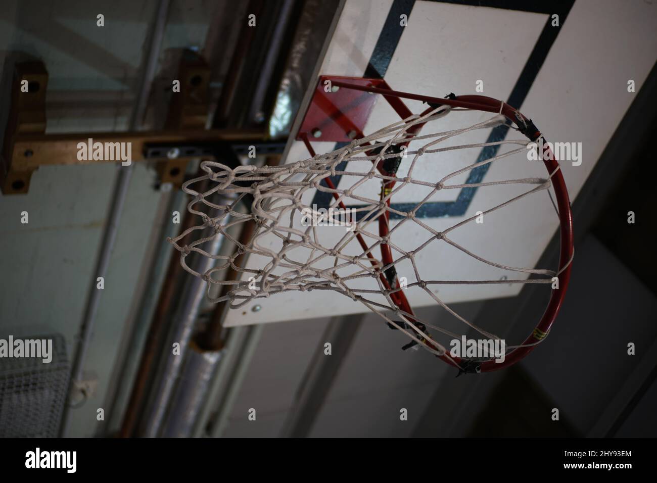 Vertical low angle shot of a hanging basketball hoop Stock Photo - Alamy