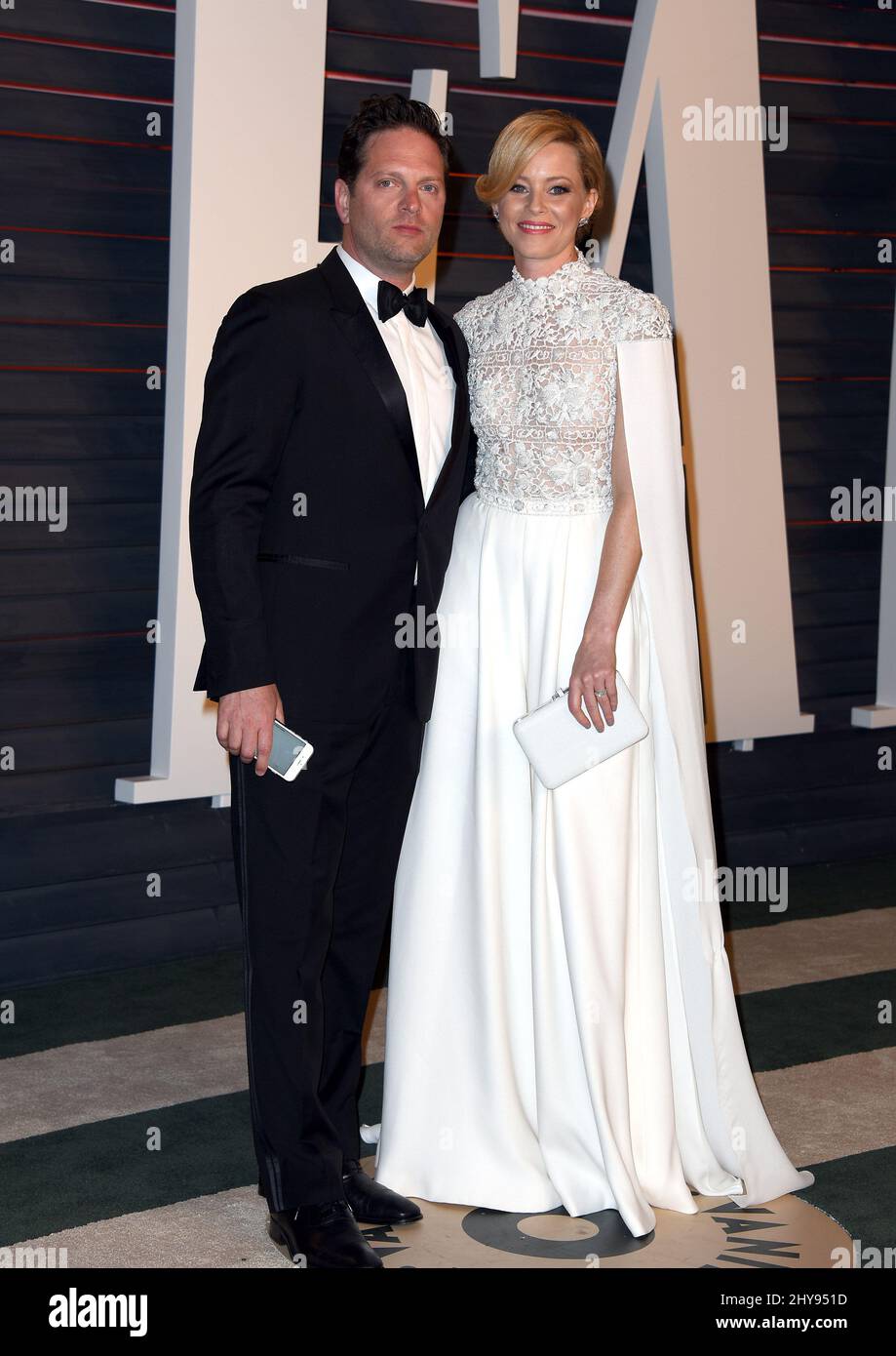 Elizabeth Banks and Max Handelman attending the 2016 Vanity Fair Oscar ...