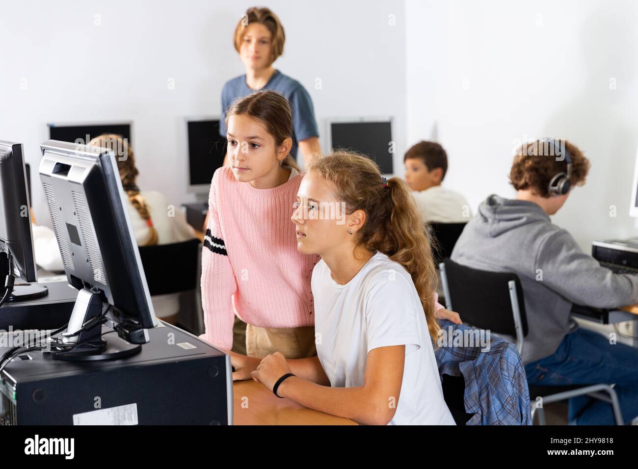 Portrait of two schoolgirls at the computer Stock Photo - Alamy