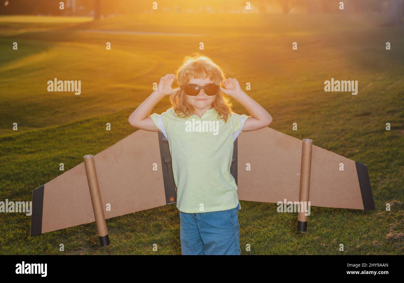 Child imagination with cardboard wings dream to be pilot. Creative and ...