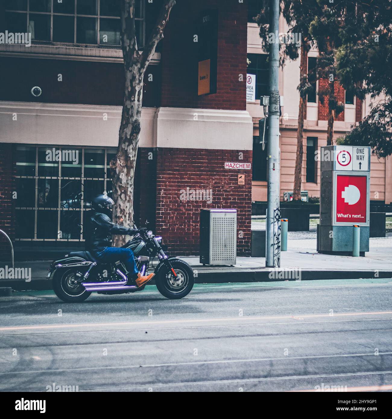 Shot of a man riding a motorcycle around the city of Melbourne Stock ...