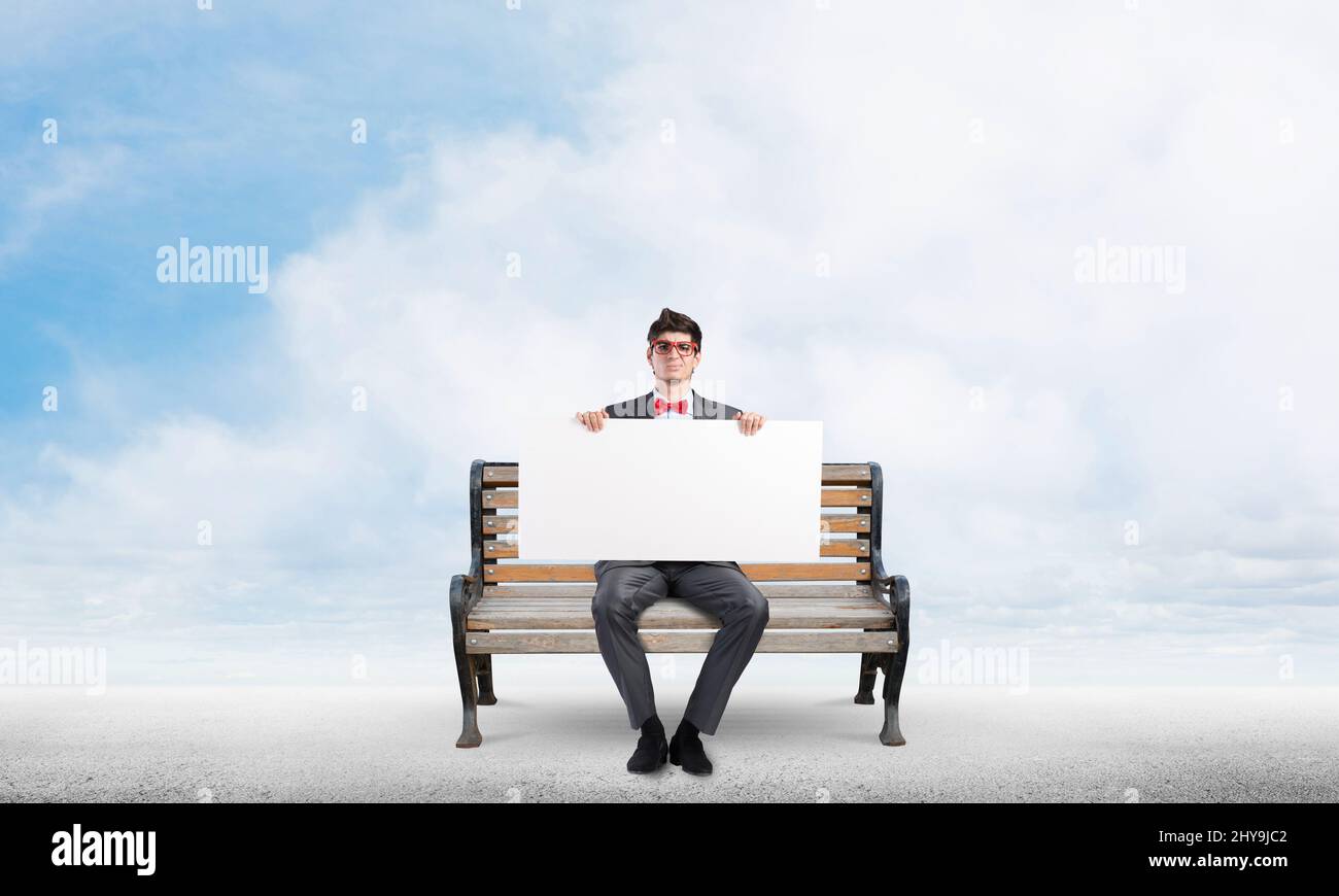 Businessman with an empty banner Stock Photo - Alamy