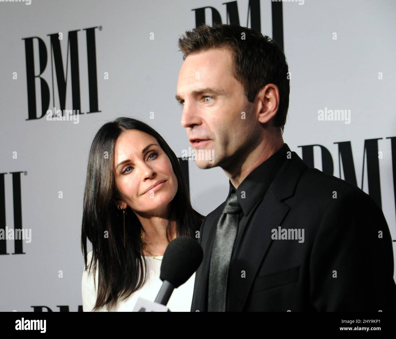 Courteney Cox and Johnny McDaid attending The 64th Annual BMI Pop ...