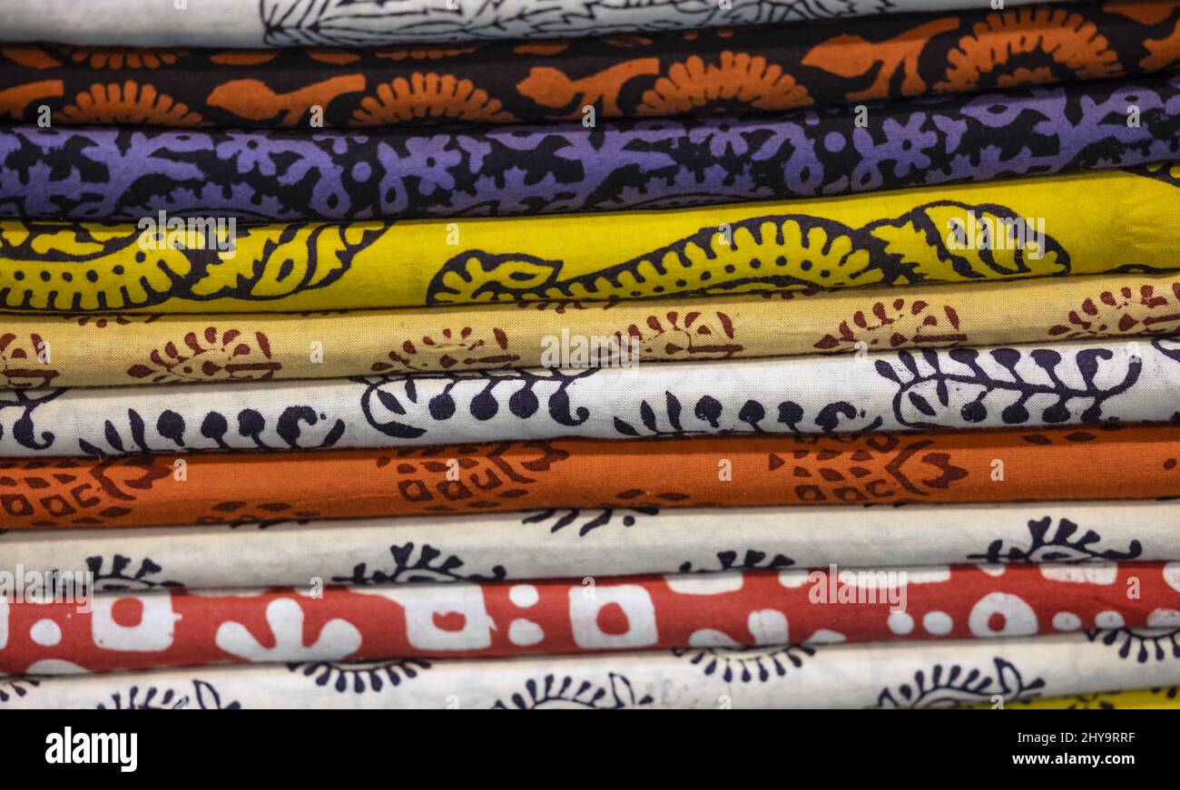 Colorful fabrics sorted together with different simple drawing designs ...