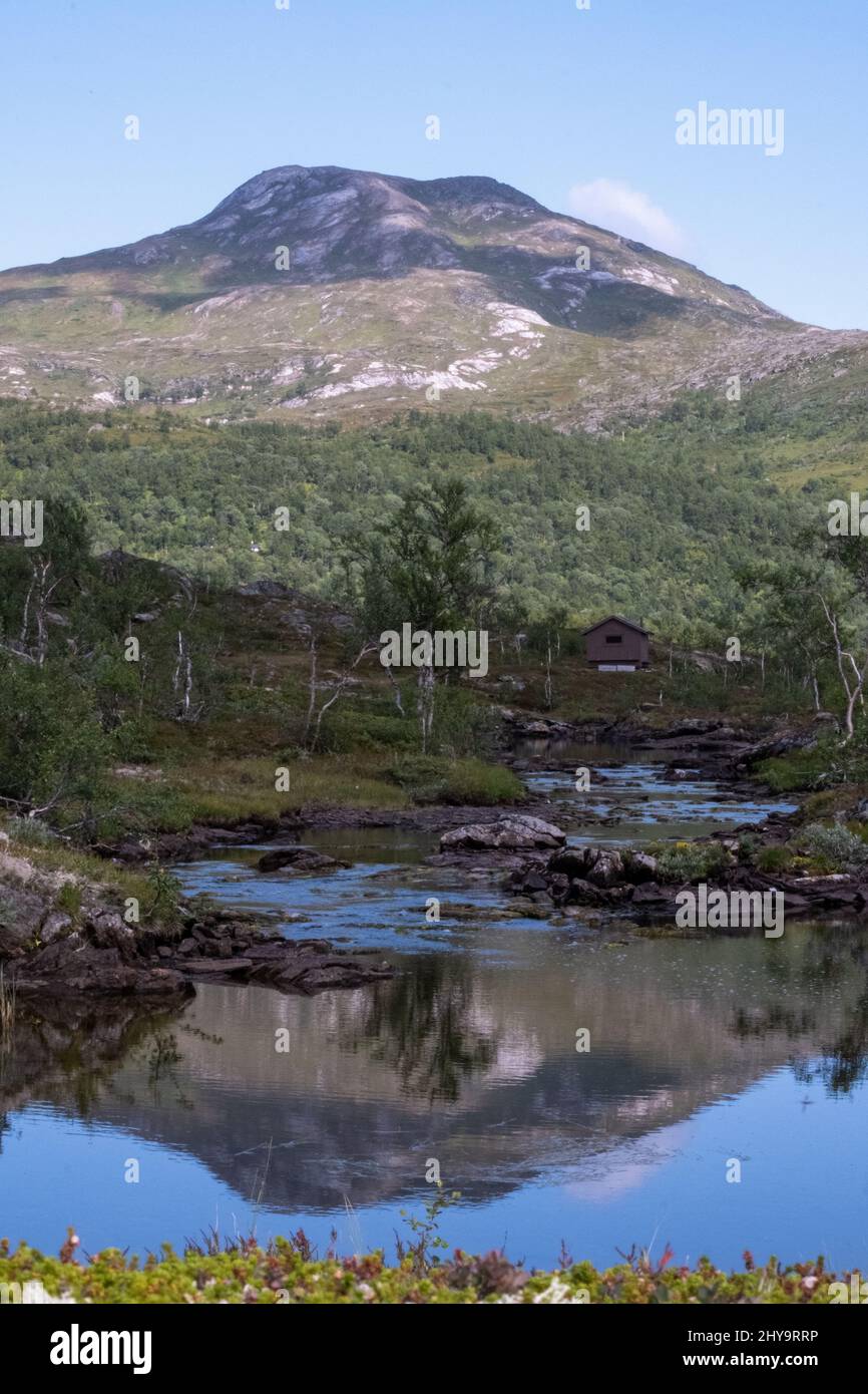 Natural view of the mountain and clear blue sky reflecting on a calm ...