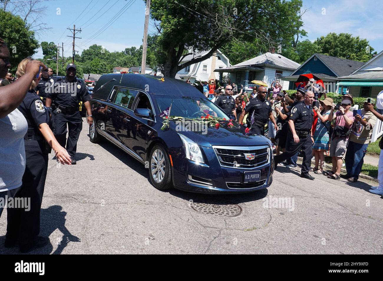 Fans watch the hearse on Grand Ave ( boyhood home) during the Muhammad ...