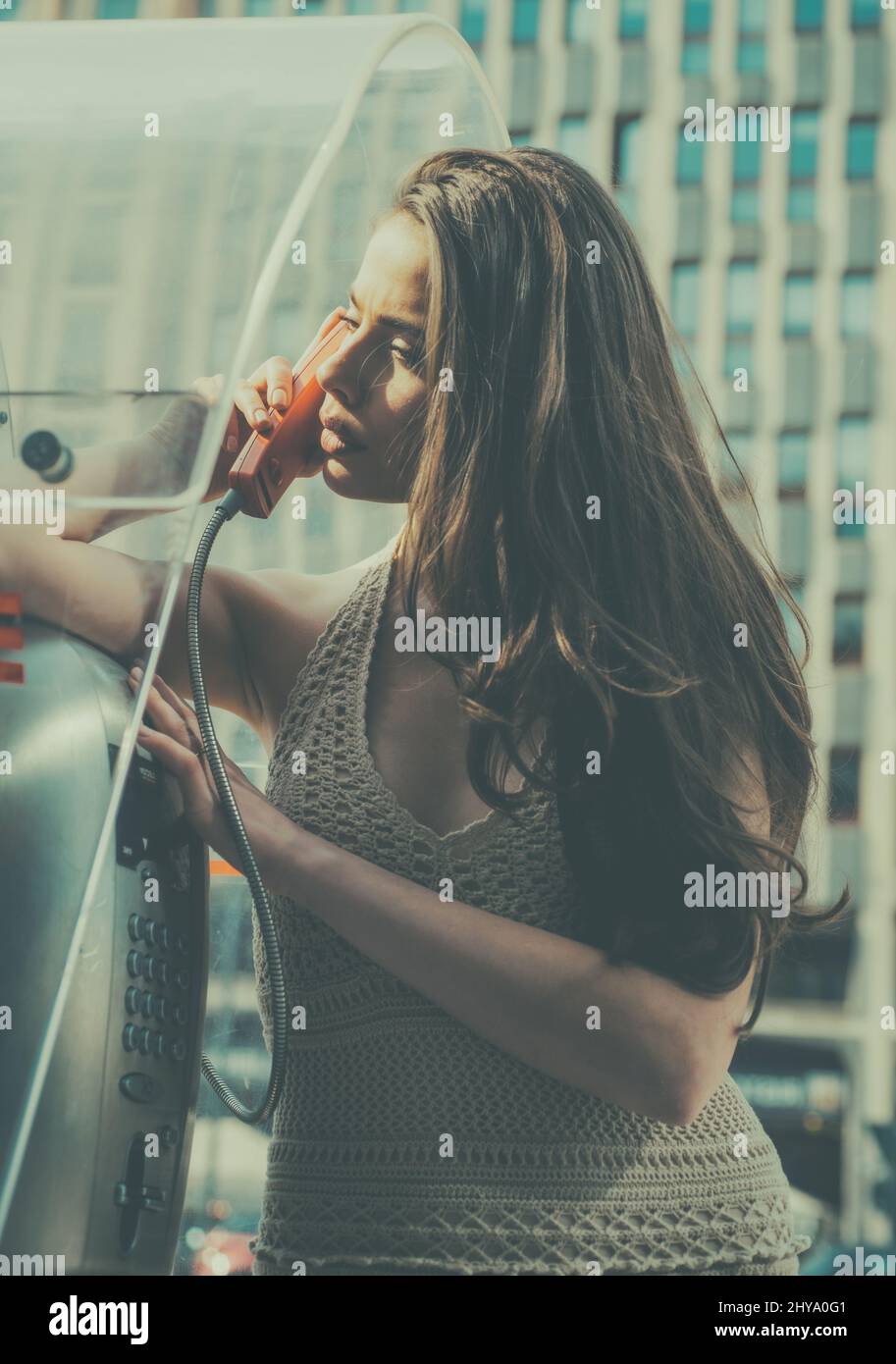 Oldstyled city. Vintage concept. Woman with payphone. Communication ...