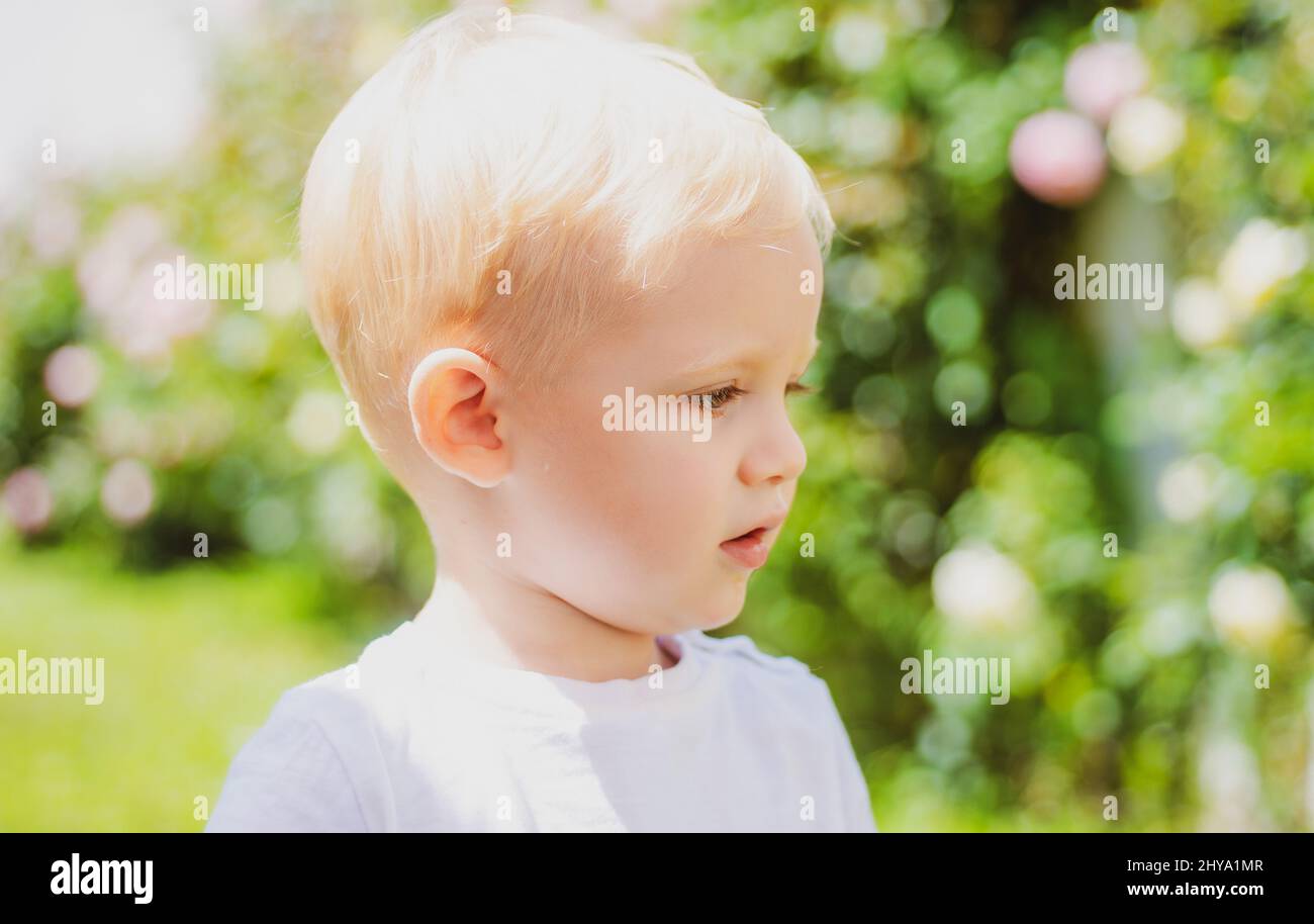 Cute boy face. Closeup portrait of smiling child on outdoor background ...