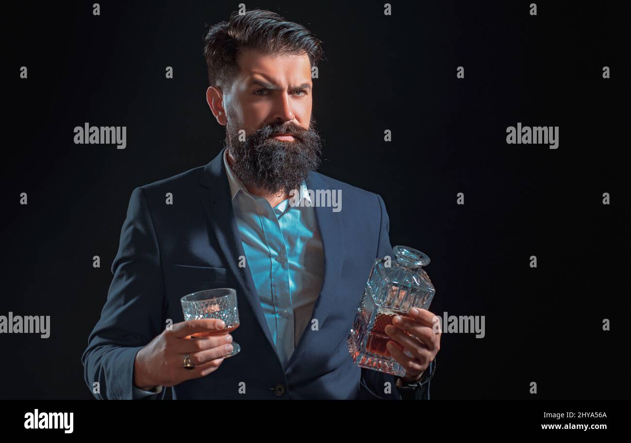 Drinking man. Alcohol abuse: drunk man looking at a glass of whiskey ...