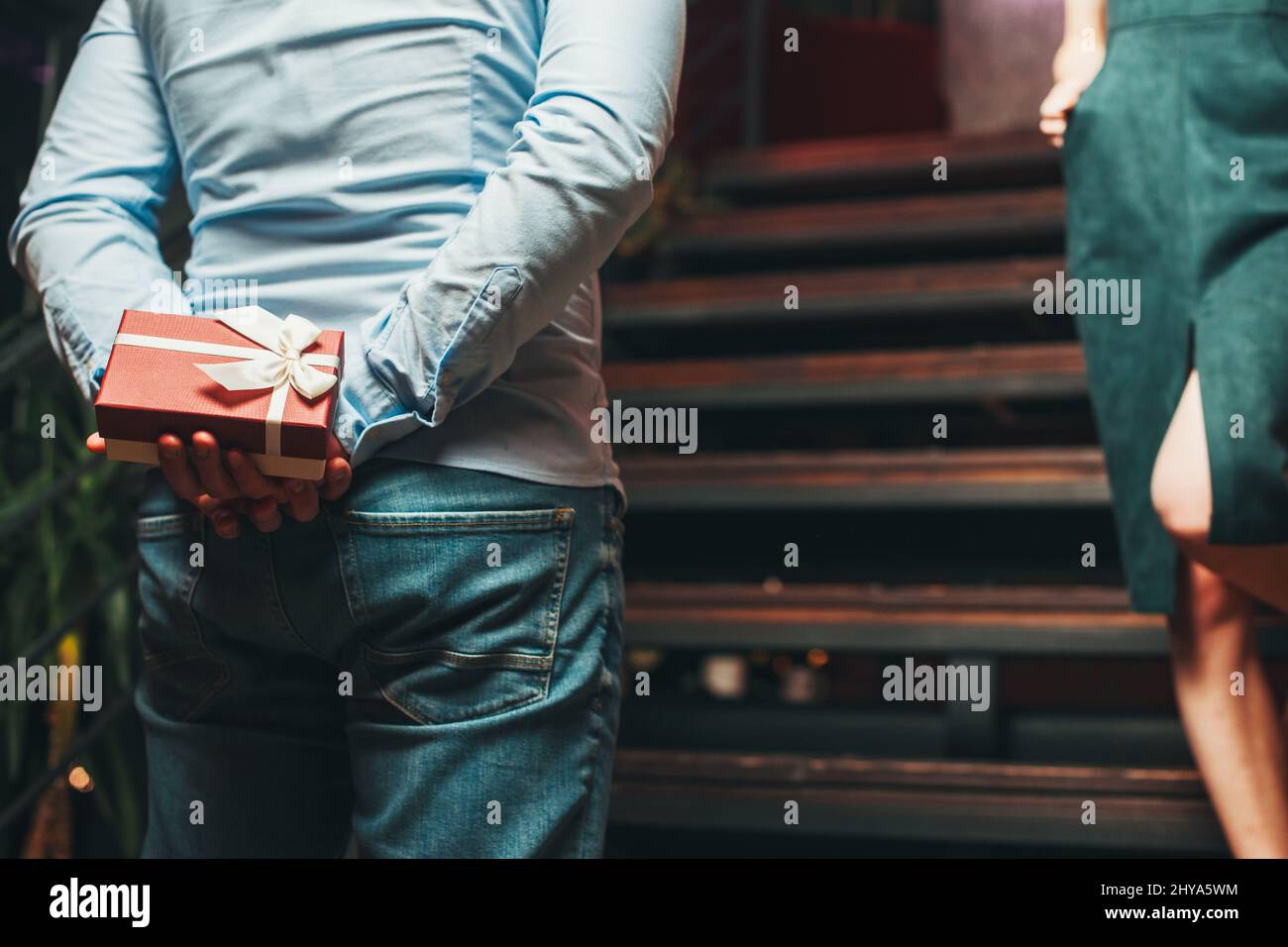 Girl hiding behind man hi-res stock photography and images - Alamy