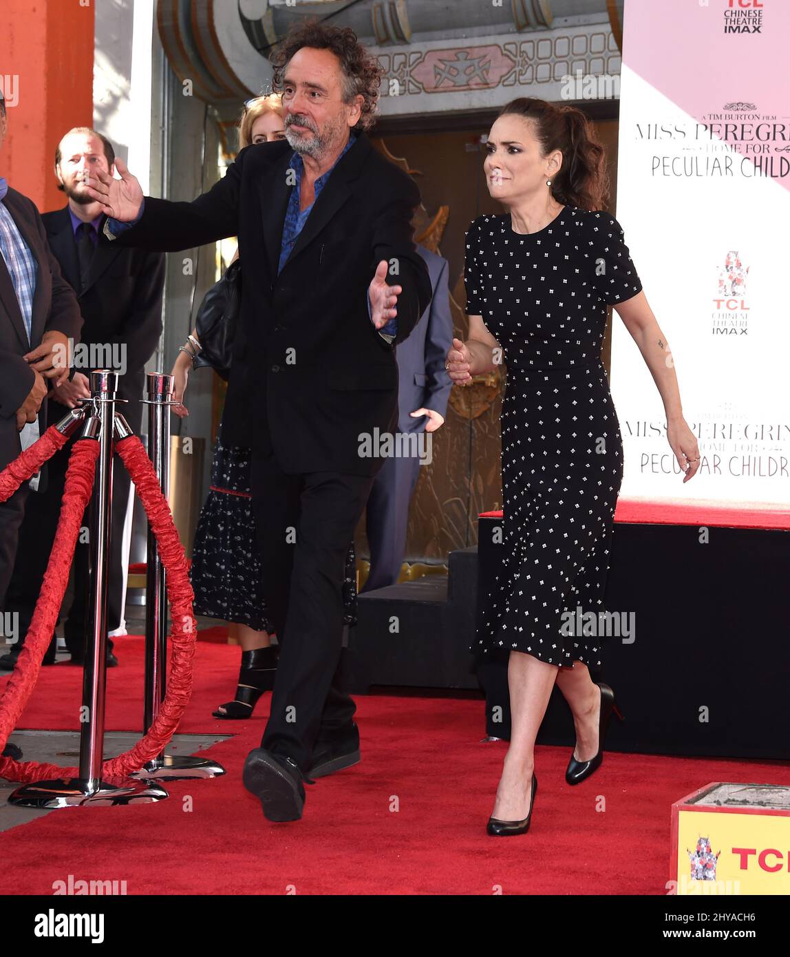 Tim Burton and Winona Ryder at Tim Burtons hand and footprint ceremony ...