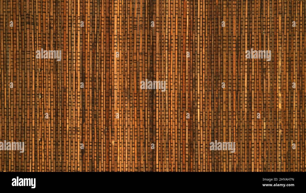 woven texture of brown sticks with a vertical arrangement studio photo ...