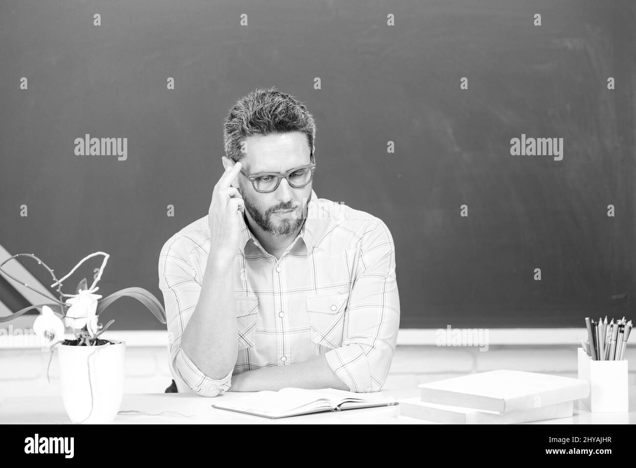 Serious teacher young with students Black and White Stock Photos ...
