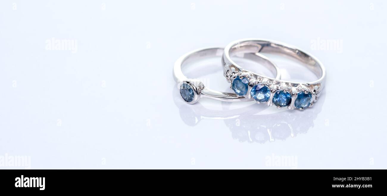 Blue Sapphires Jewel or gems ring on white background with reflection ...