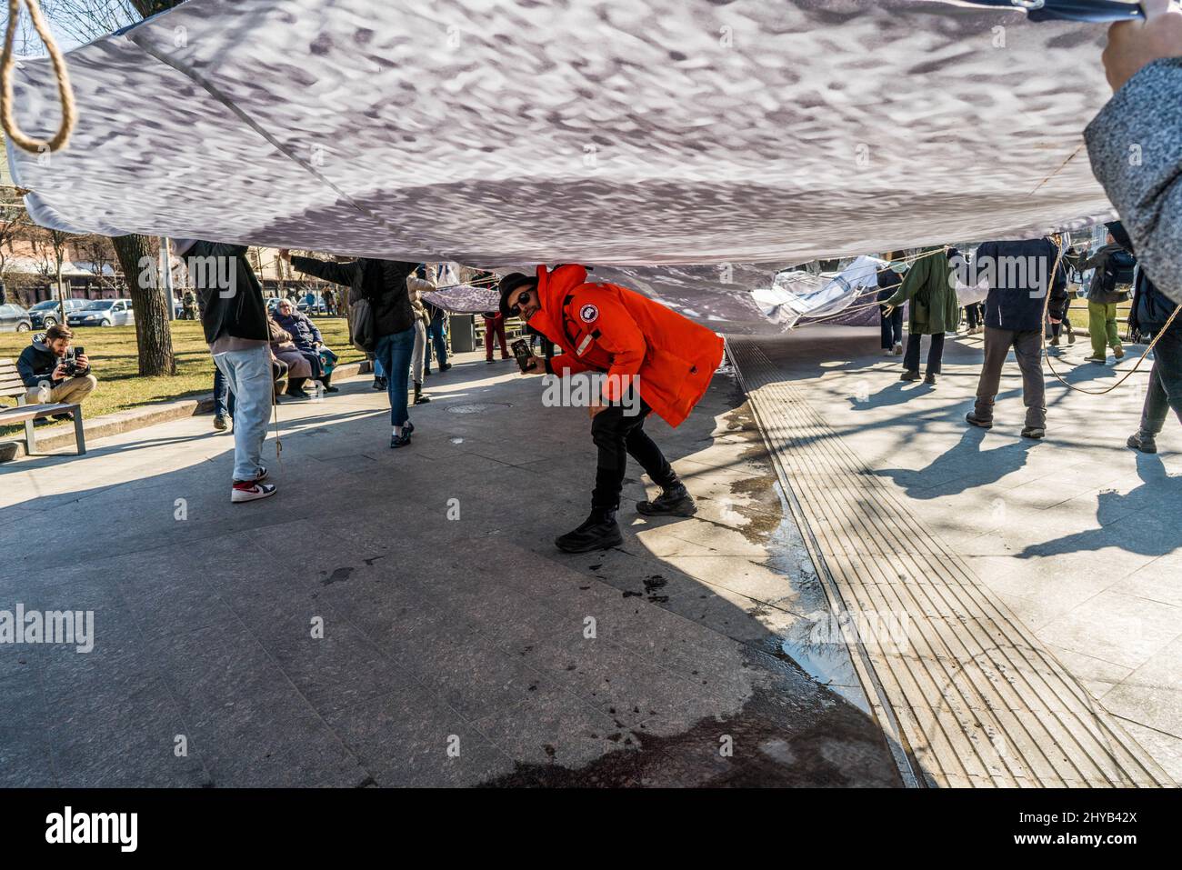 The French artist JR under his work in Lviv, Ukraine on March 14, 2022 ...