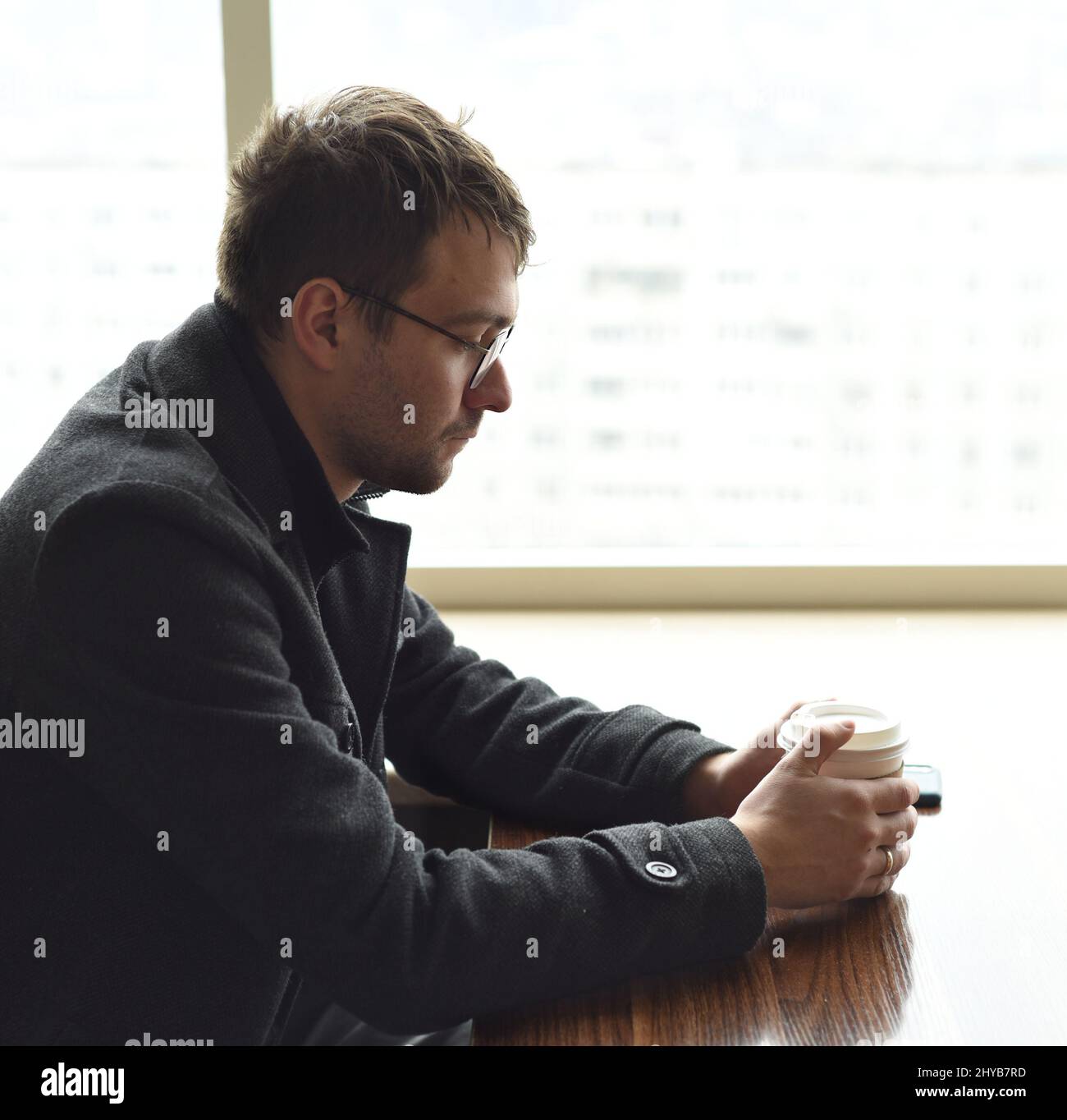 Upset depressive russian man looking thoughtfully to the side. paper ...