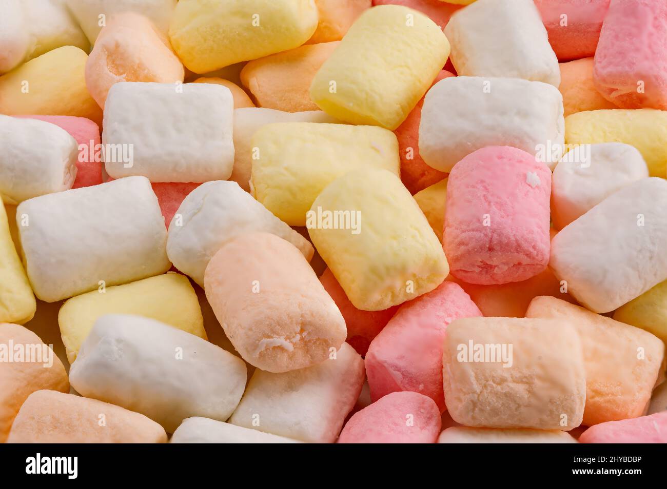 Closeup view pile of colorful marshmallows. Texture of fluffy mini ...