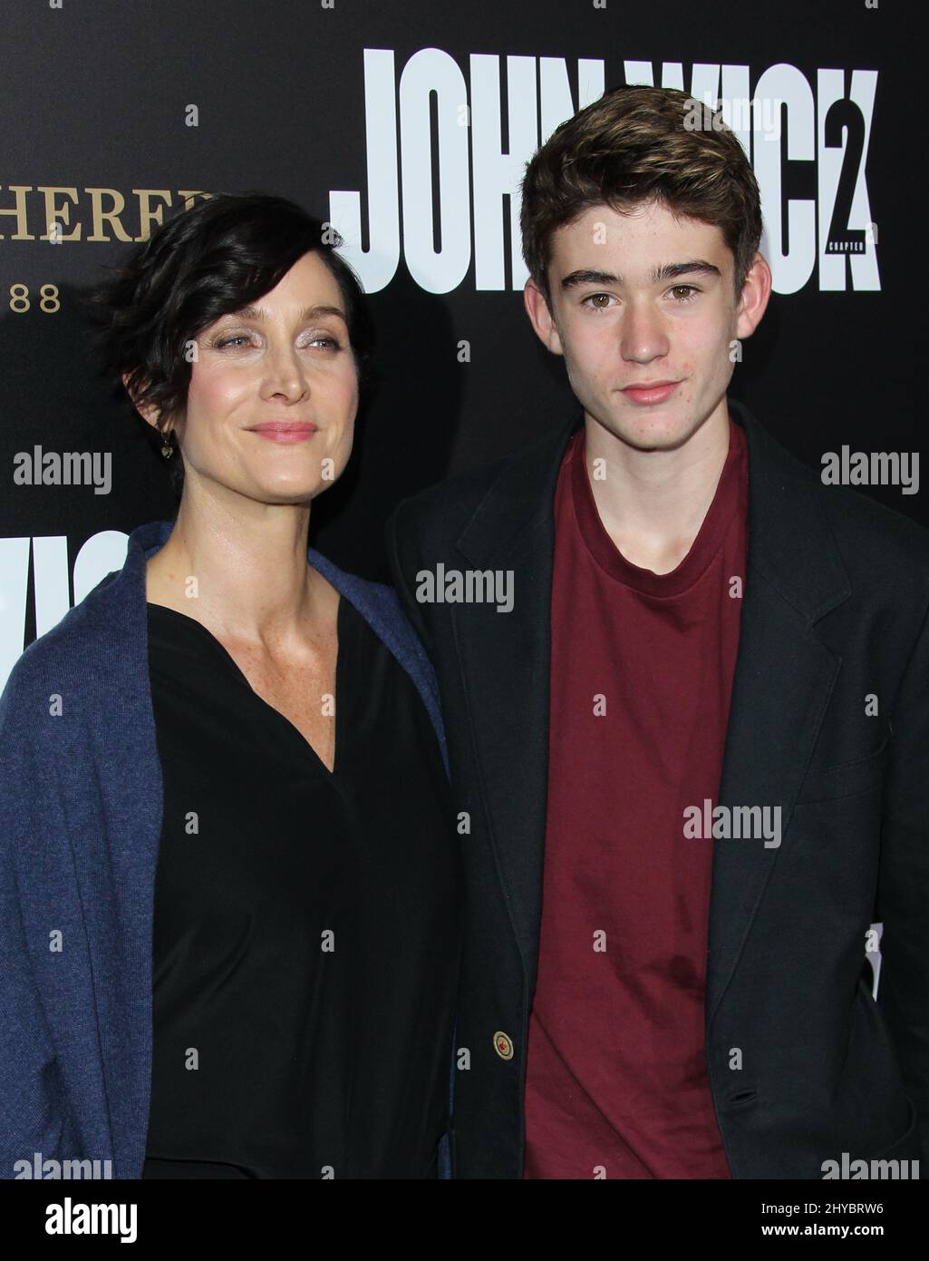 Carrie-Anne Moss and Owen Roy attending the premiere of John Wick ...