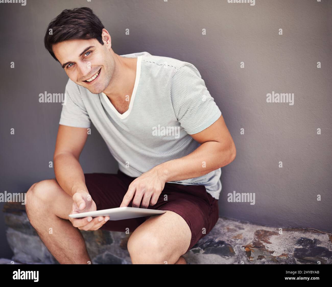 Happy man holding ipad hi-res stock photography and images - Alamy