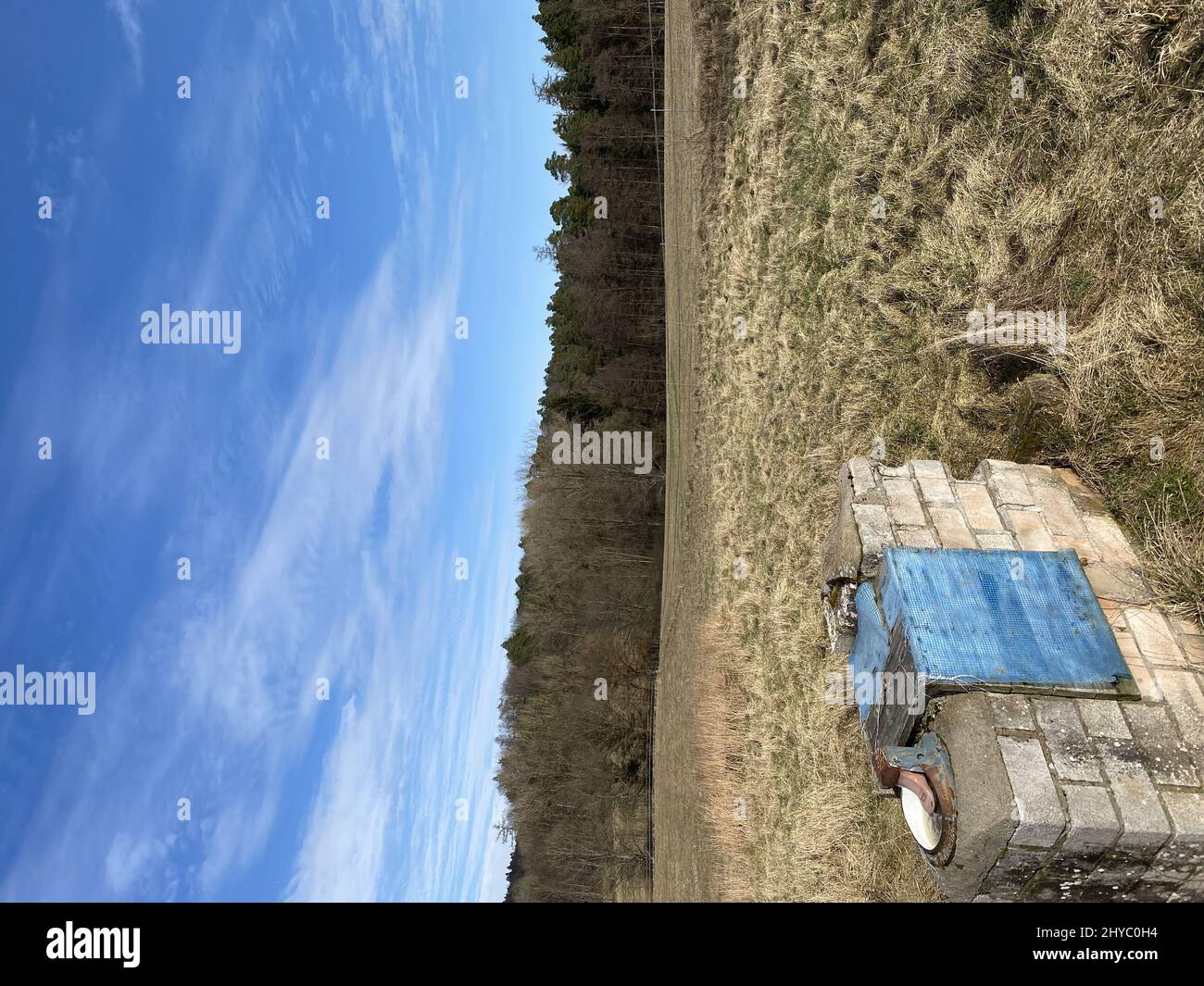 Vertical shot of stack of weathered hollow blocks with blue sack in the ...