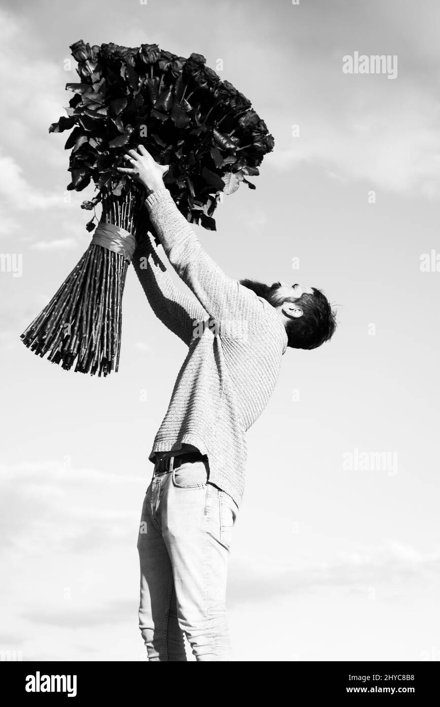 Man with Big bouquet of roses. Celebrate Valentines Day and Romantic ...