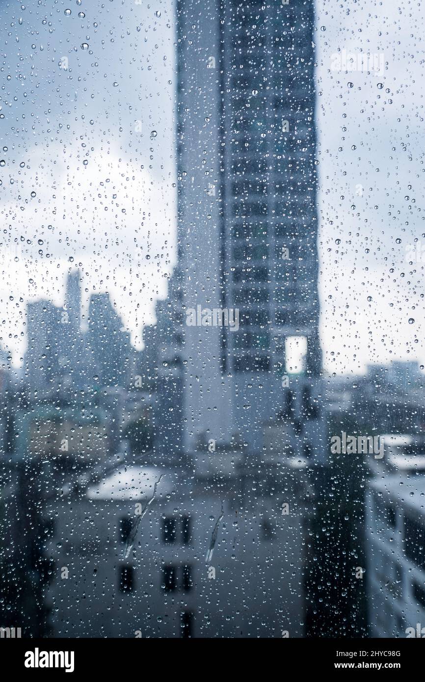 Abstract image of Rain drops on the dirty glass windows with modern ...