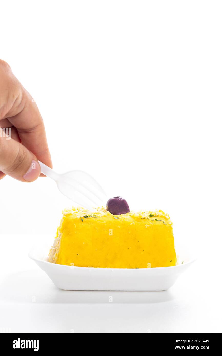 Closeup of a Peruvian food called causa made with chicken and mashed ...