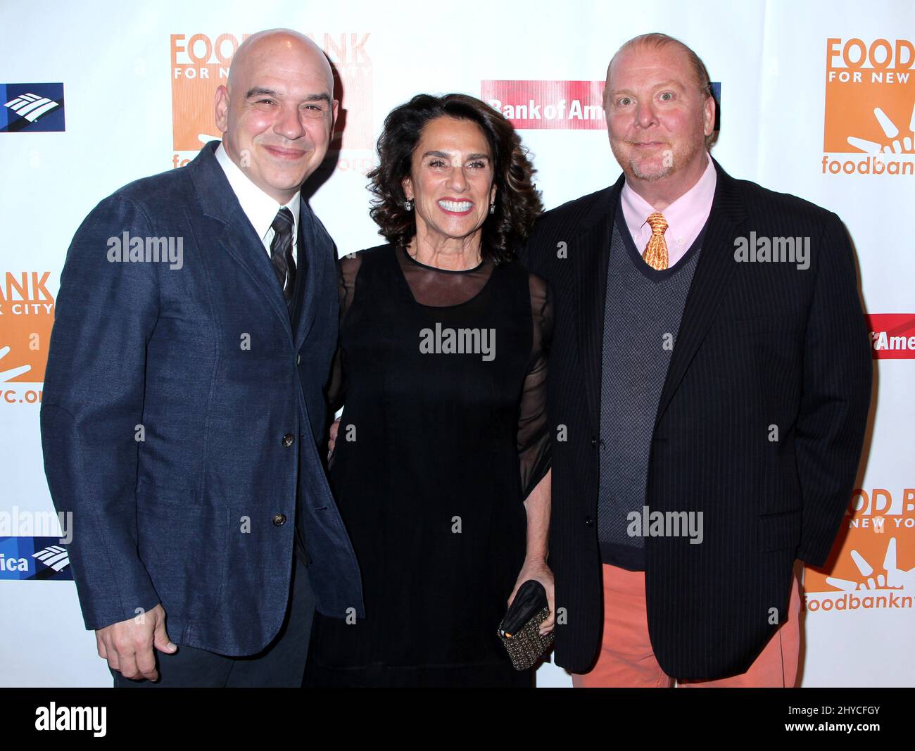 Michael Symon, Mario Batali & wife Susi Cahn attending the Food Bank ...