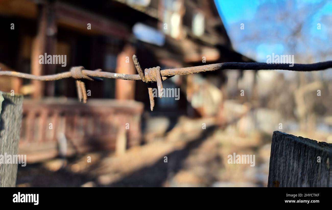 Closeup shot of a rusty barbed wire outdoors on a sunny day Stock Photo ...