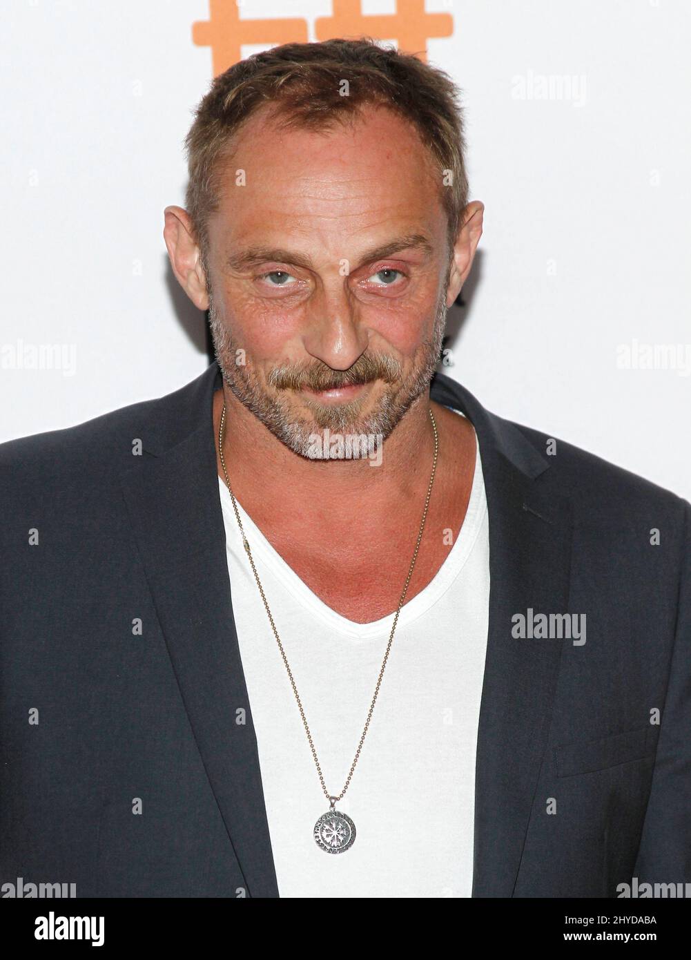 Roland Moller arriving at the "Papillon" premiere at the 2017 Toronto ...