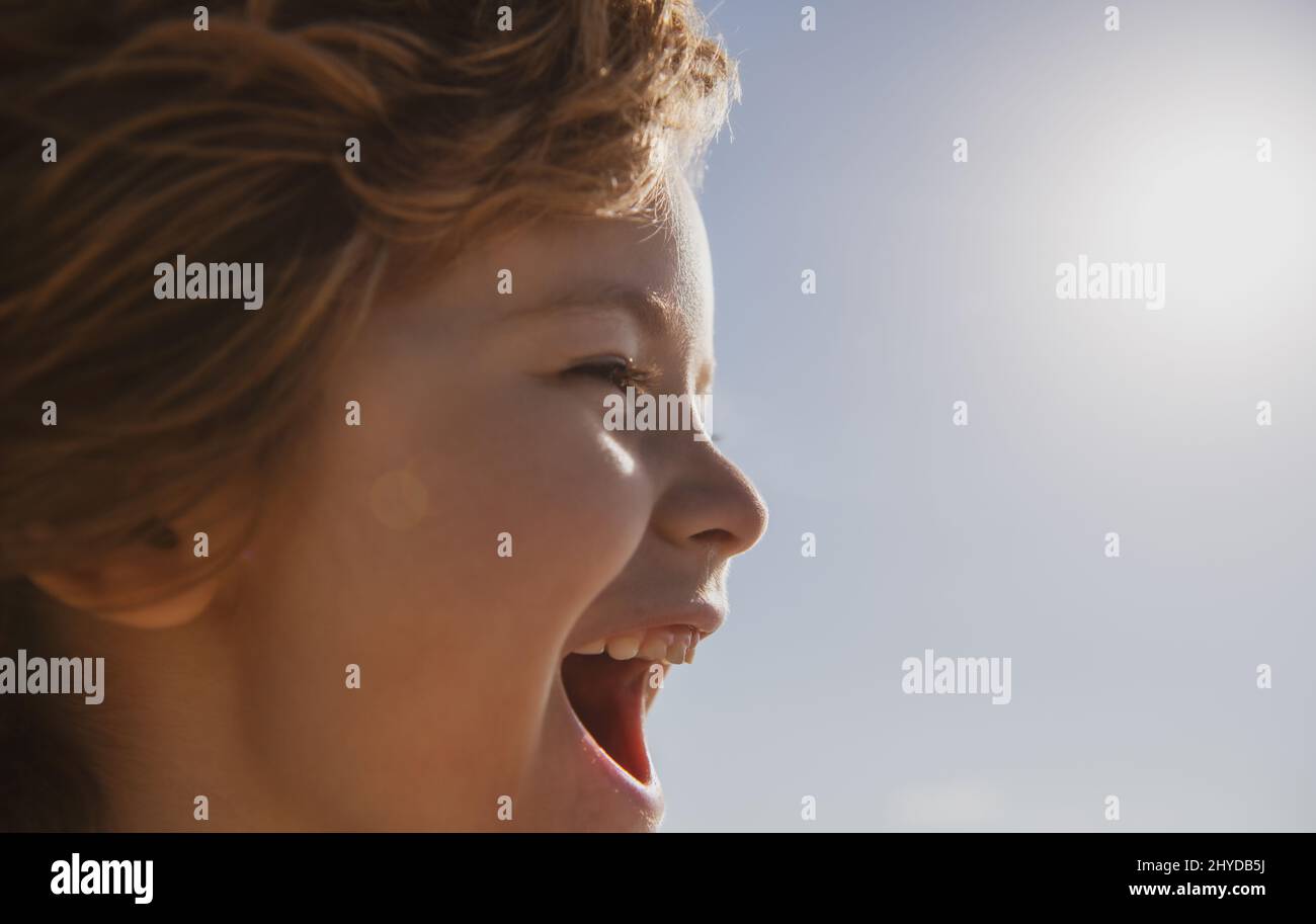 Portrait of a happy laughing child. Close up positive kid screaming ...