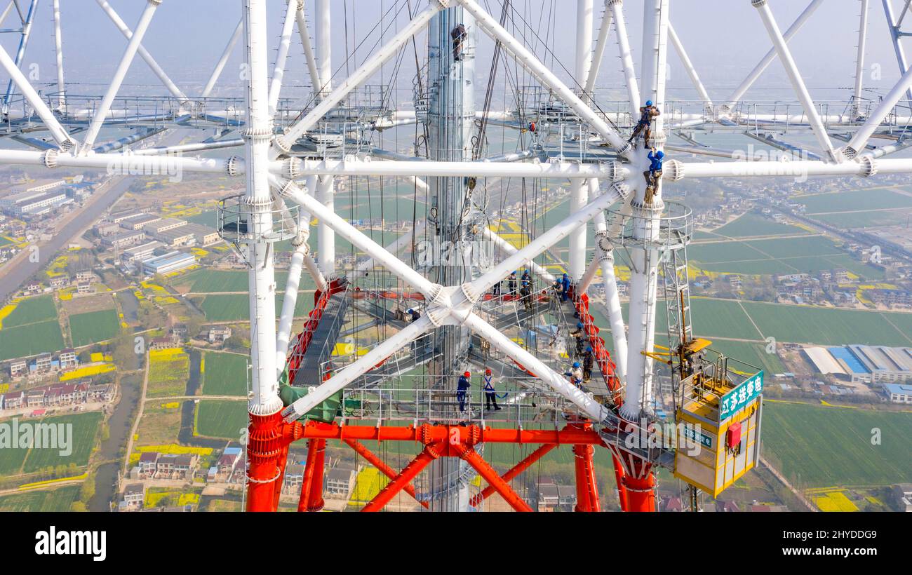 TAIZHOU, CHINA - MARCH 15, 2022 - Workers install an elevator shaft 350 meters above the ...
