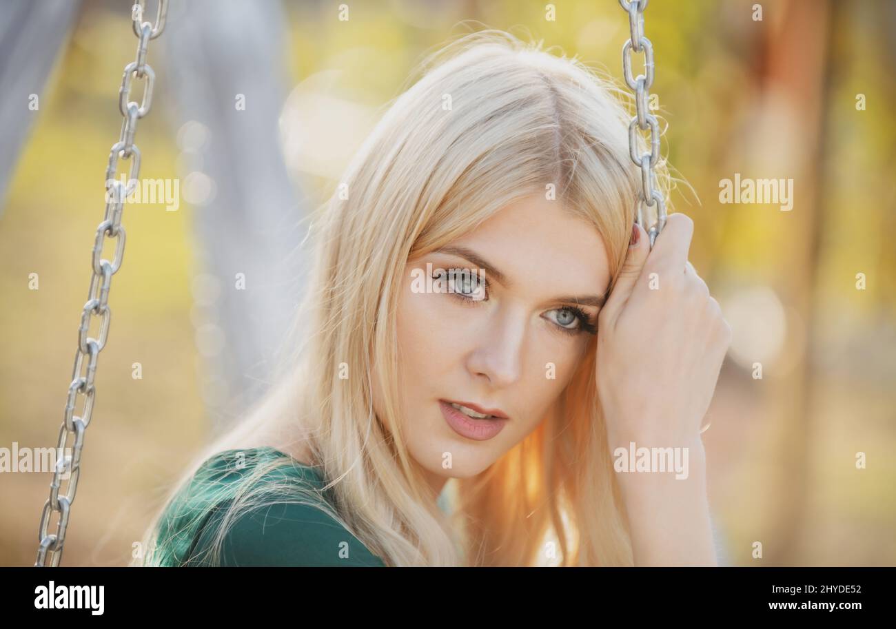 Portrait of a young thoughtful pensive woman, close up face of ...