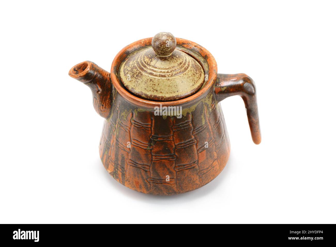 Antique stone tea pot on white background Stock Photo - Alamy
