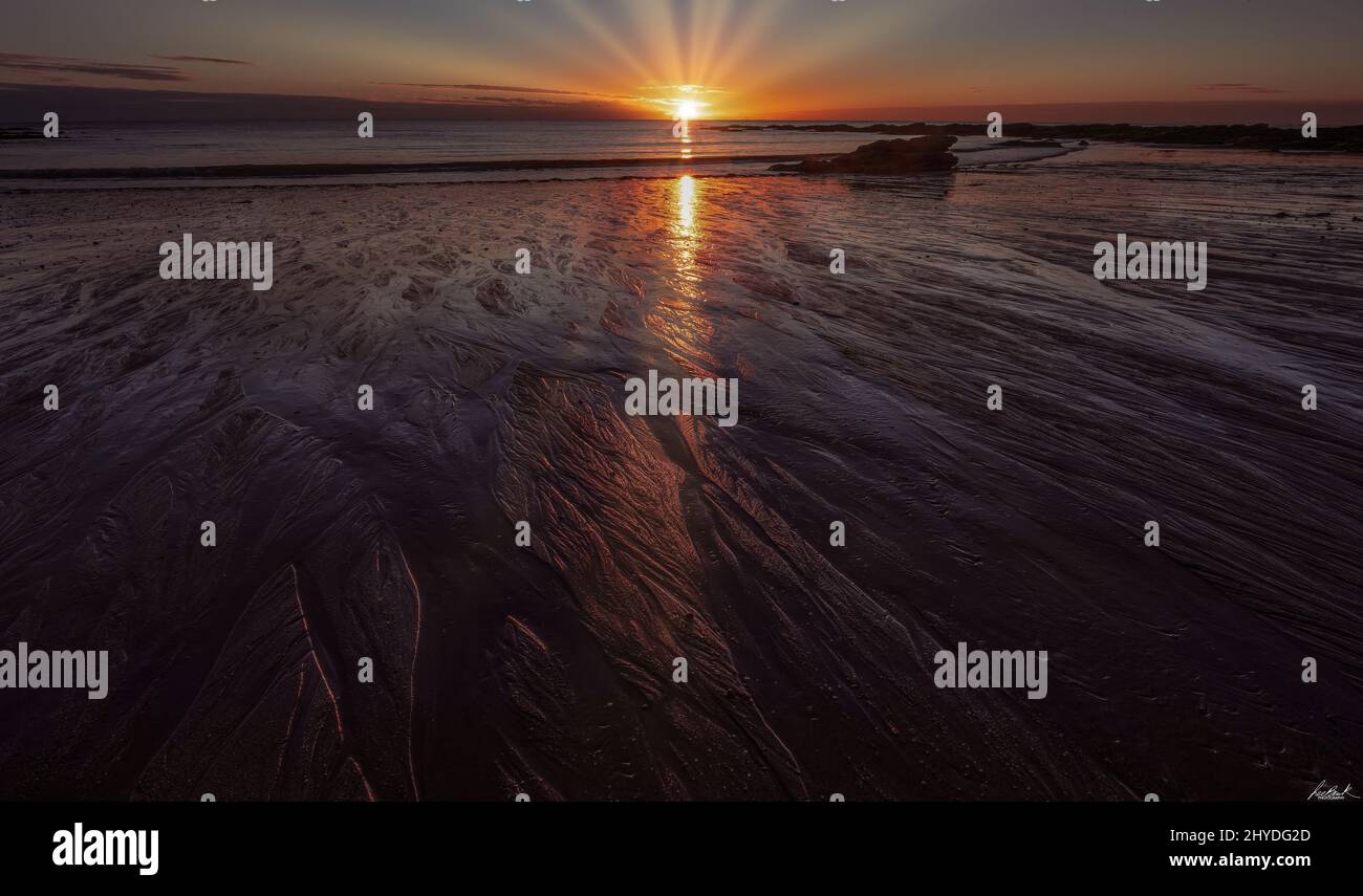 Mesmerizing view of a beautiful seascape at scenic sunset Stock Photo ...