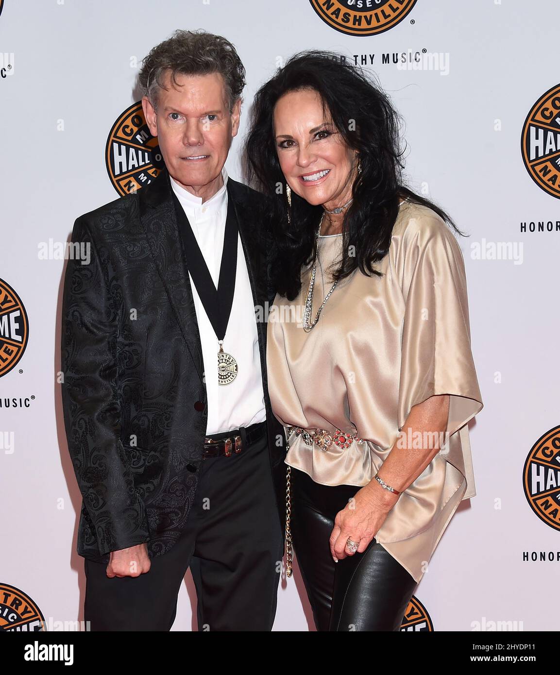 Randy Travis and Mary Davis arriving for the Country Music Hall of Fame ...