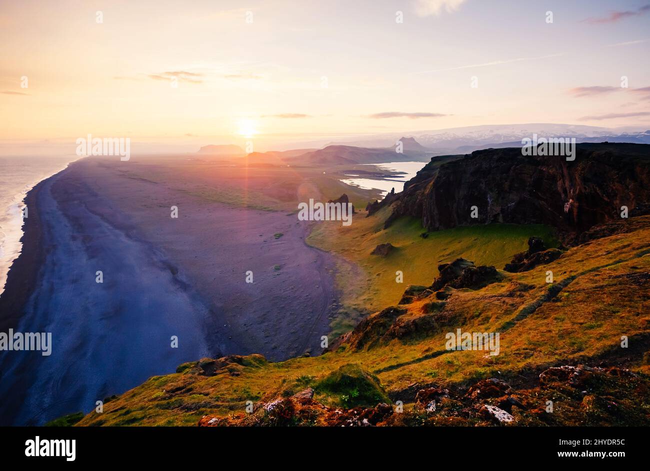 Amazing black sand of lava in the beach on small peninsula. Popular ...