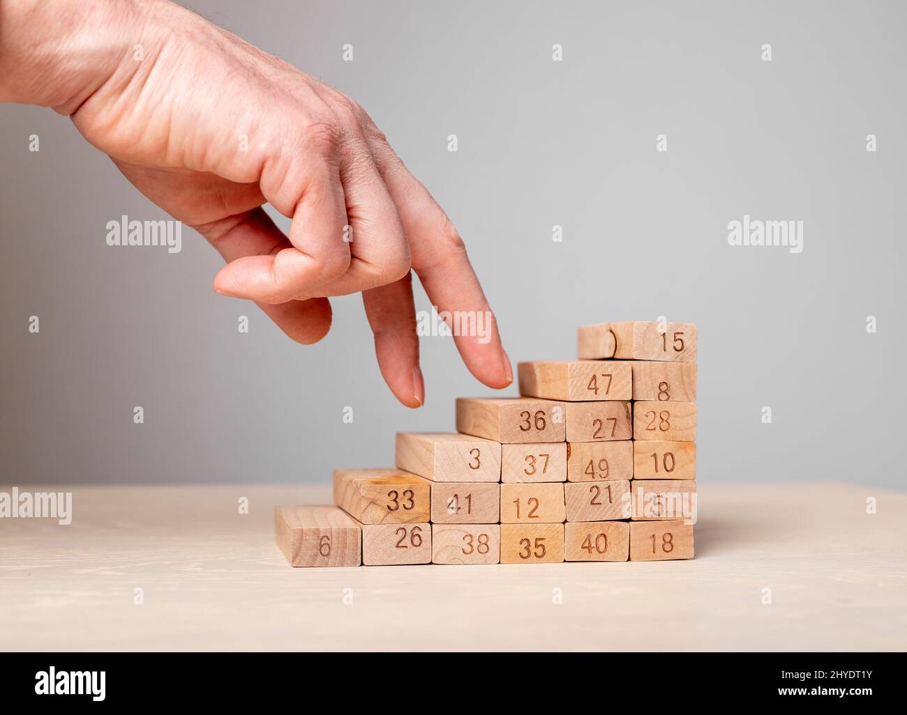 Businessman hand climbing career ladder from wood blocks. Development ...