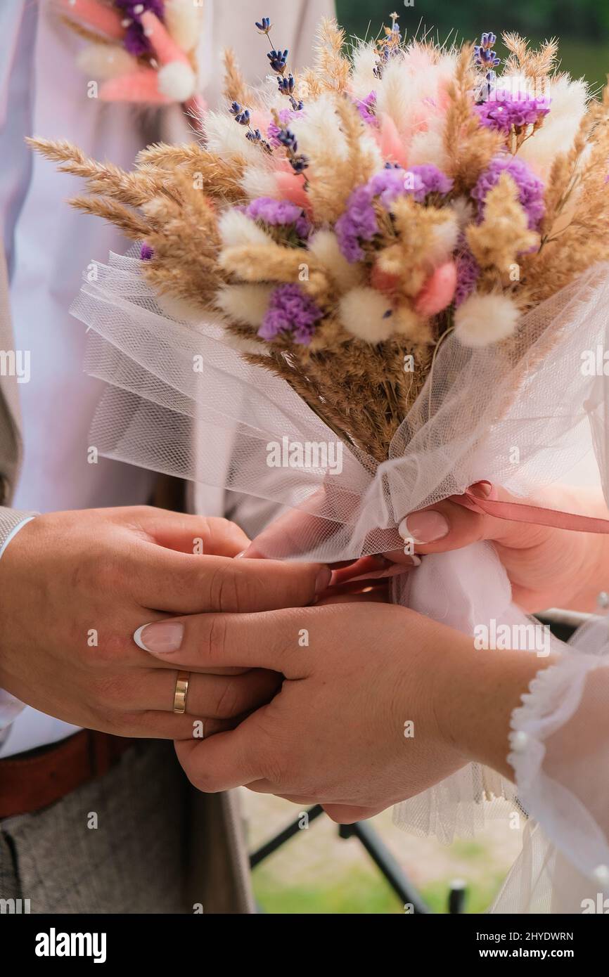 Weeding flowers background in hands. Bride holding her weeding bouquet ...